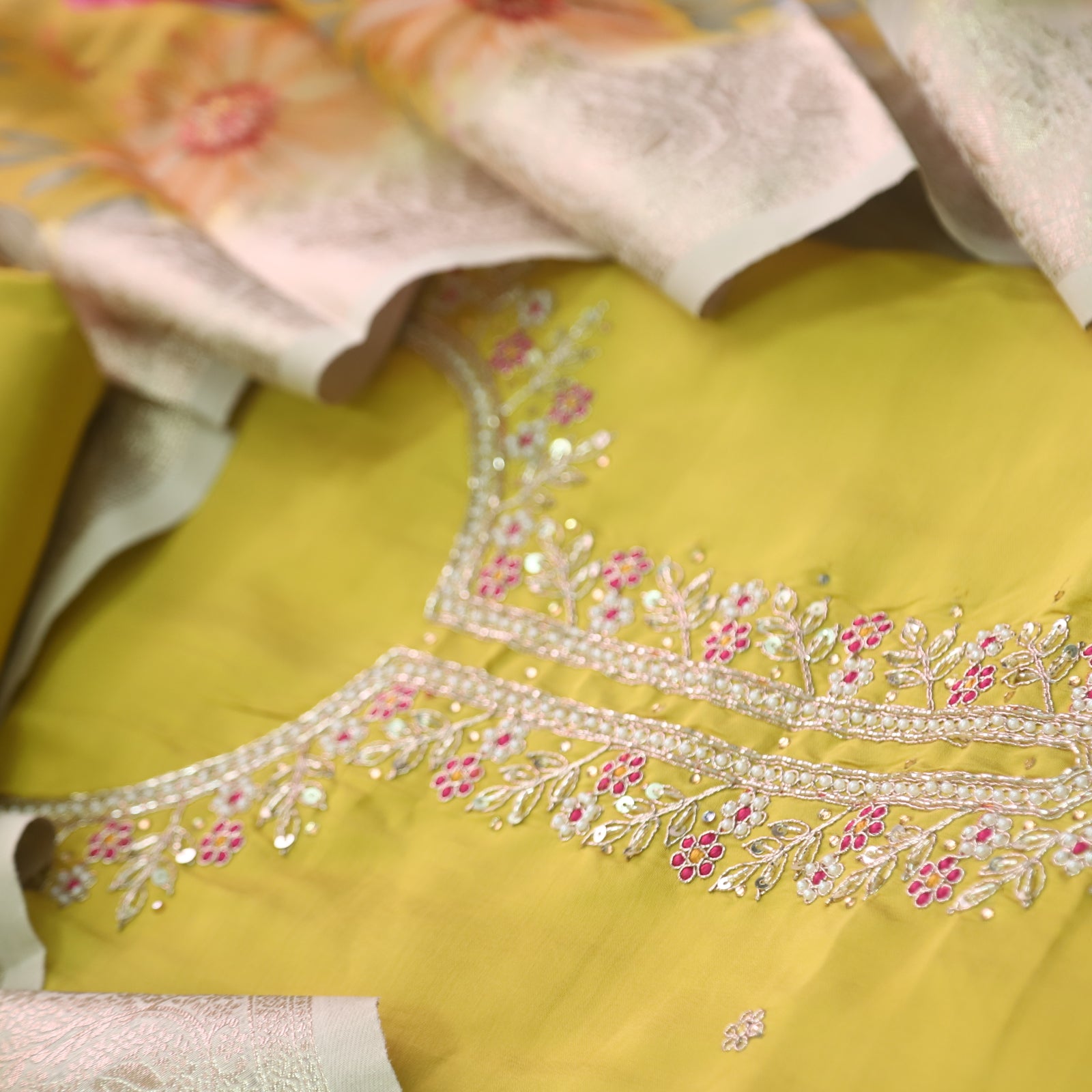 Ishaani Turmeric Yellow Embellished Neck with Moti Work Modal Suit Set ...